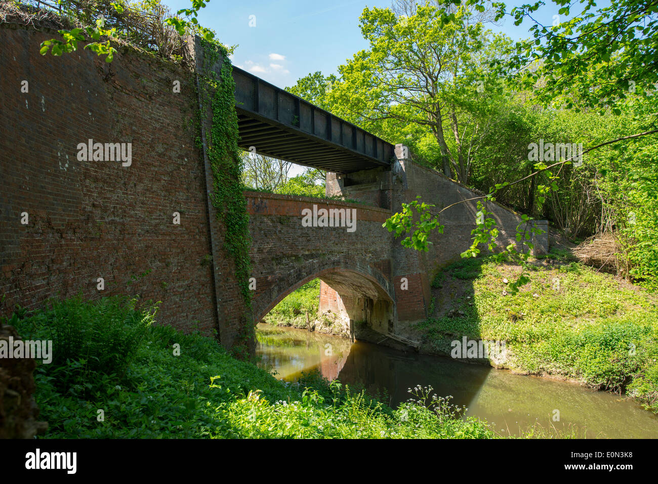 Rudgwick, West Sussex UK, 16th May, 2014. Sunlit River Arun runs under ...