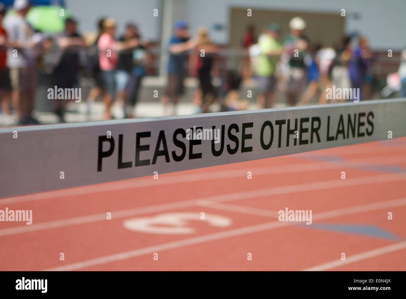 running track sign "please use other lanes Stock Photo - Alamy