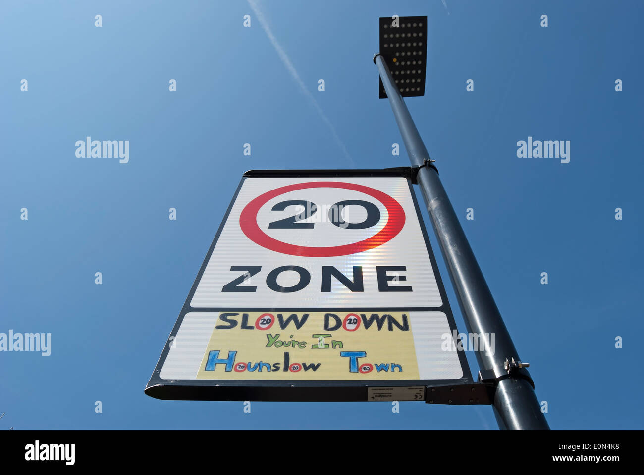 british road sign indicating 20mph zone with local wording beneath ...
