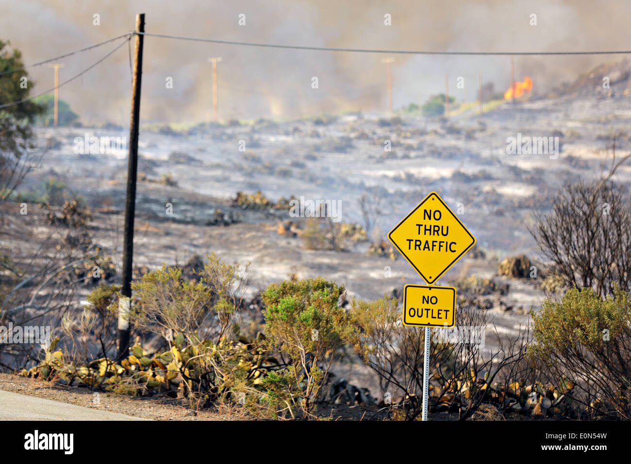 Charred remains at the Tomahawk fire burns across dry brush May 14 ...