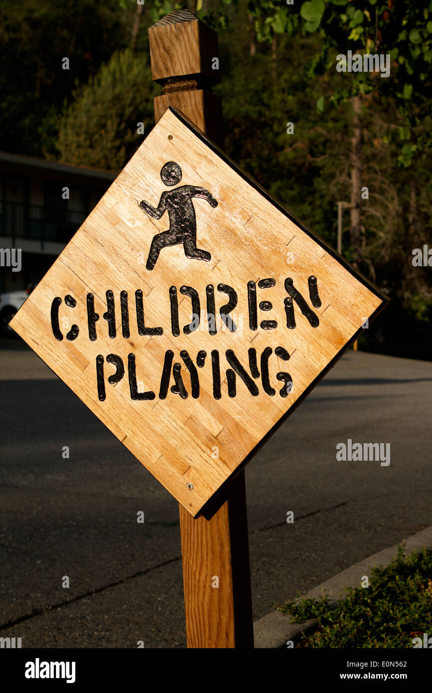 Wooden Children playing warning sign Stock Photo - Alamy Wooden Children playing warning sign Stock Photo - Alamy