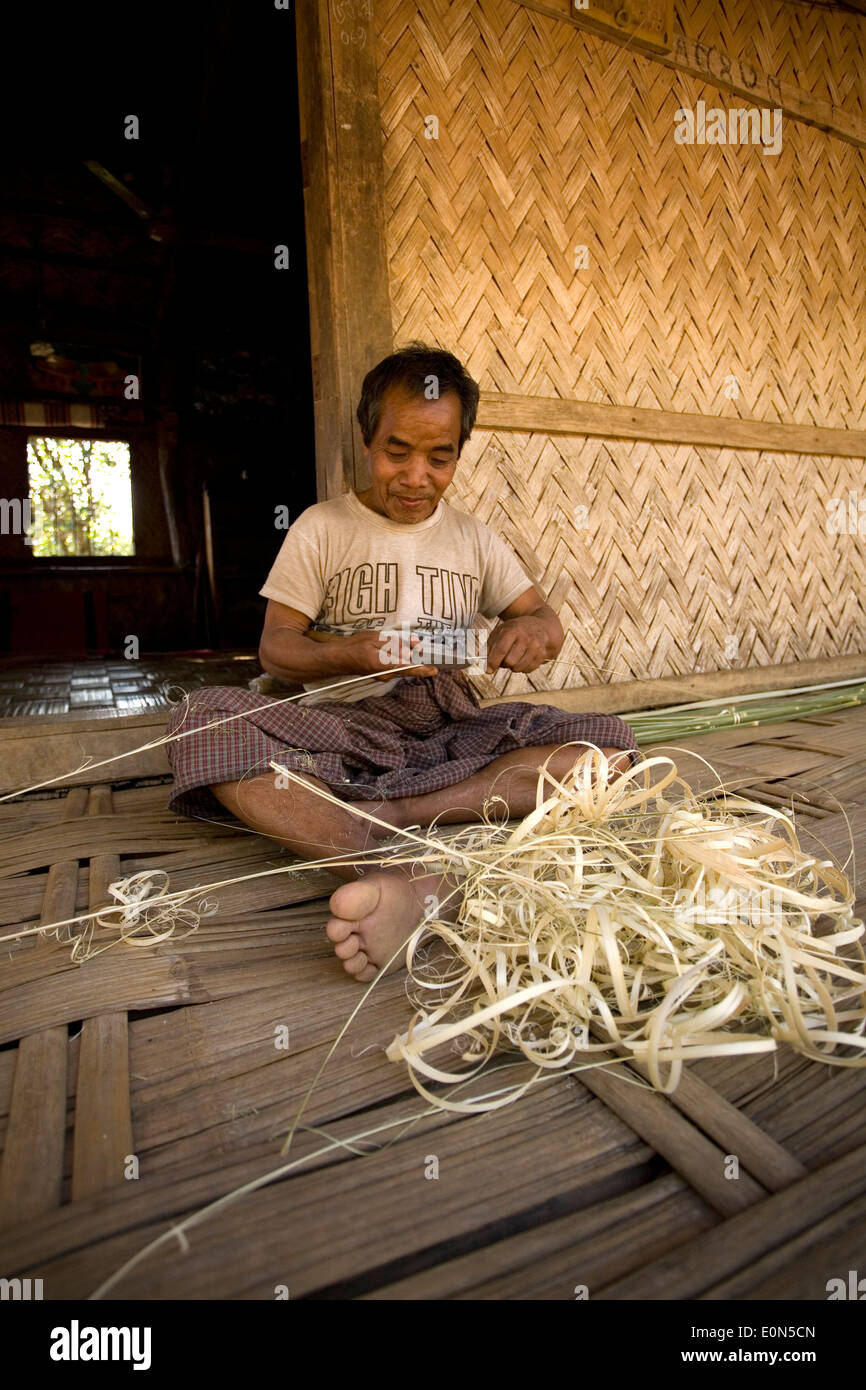 A man weaves using wood strips in the village of Farug Fara in the ...