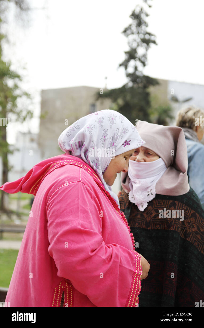 Women wearing traditional dress in a marketplace in Tangier Morocco ...