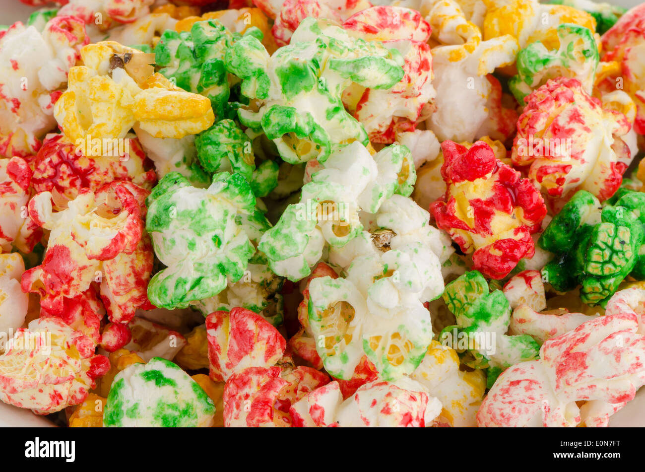 Popped color kernels of pop corn snack background Stock Photo - Alamy