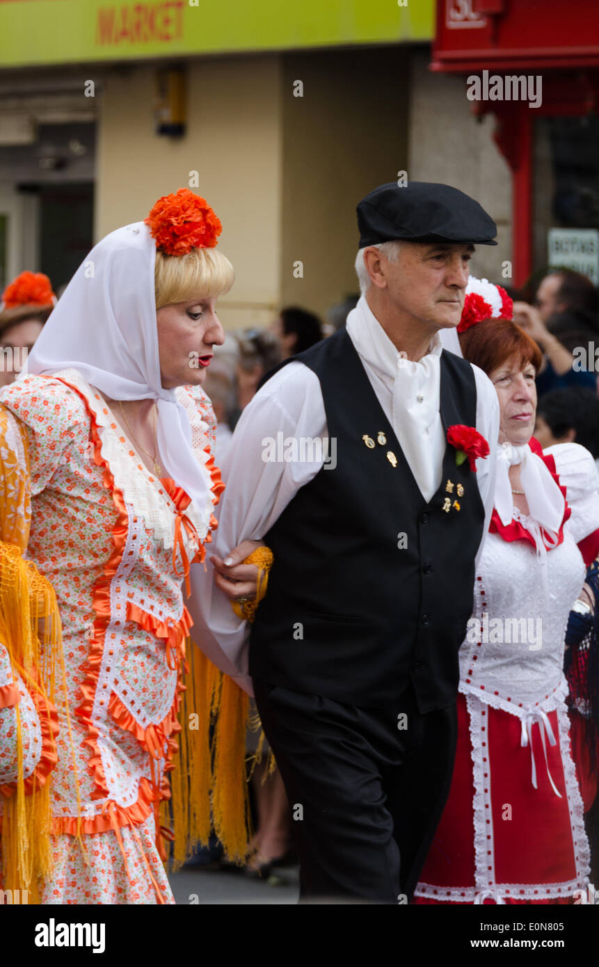 Man and women in traditional chulapo and chulapa costumes, Fiesta de ...