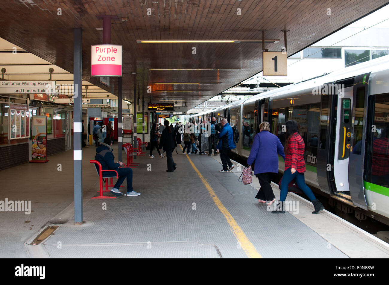 Passengers getting off a London Midland train at Coventry station, West ...