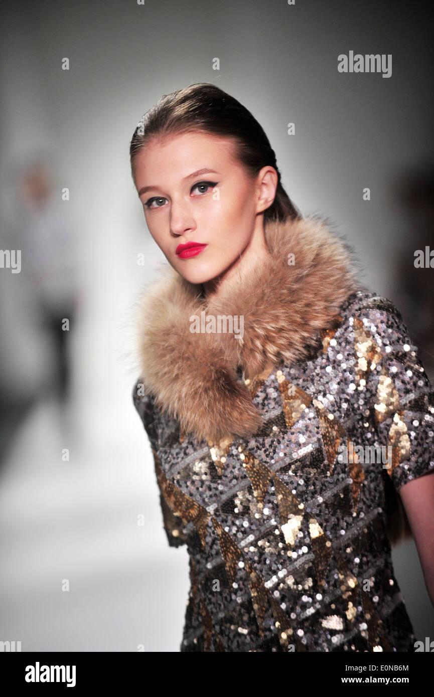 Singapore. 16th May, 2014. A model presents a creation by Malaysian ...