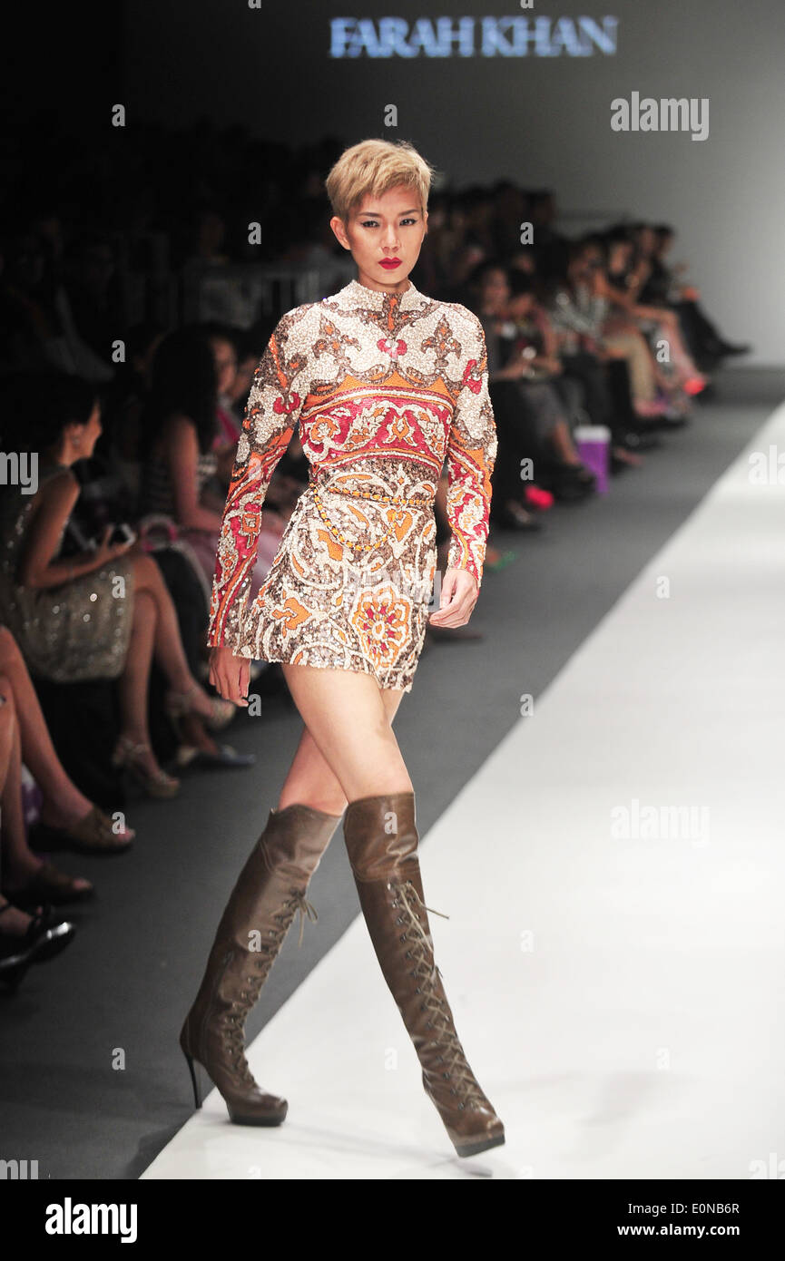 Singapore. 16th May, 2014. A model presents a creation by Malaysian ...