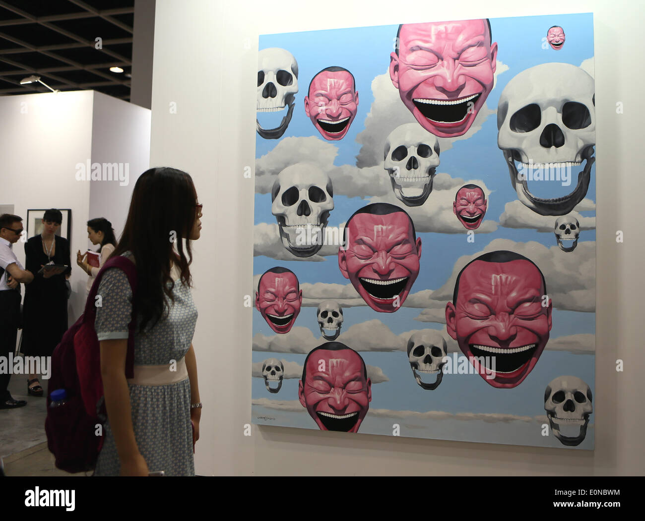 Hong Kong, China. 16th May, 2014. A visitor looks at a work by Chinese ...