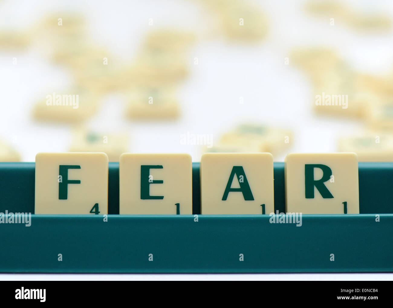 Scrabble tiles reading out the words fear Stock Photo - Alamy