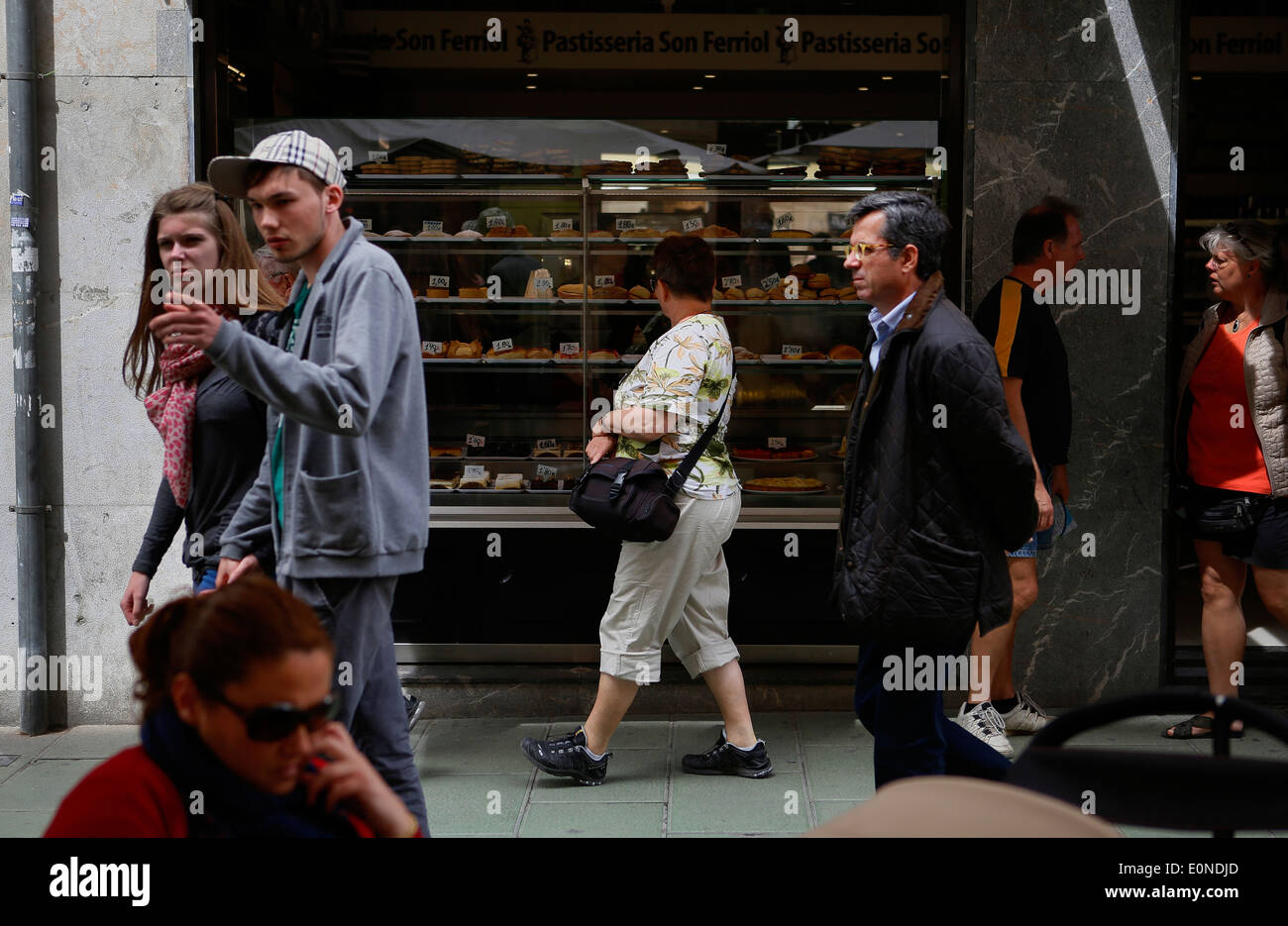 People seen walking on a commercial street downtown Palma, in the ...