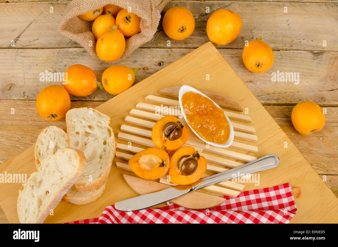 Fresh homemade loquat jam surrounded by ripe fruit Stock Photo - Alamy