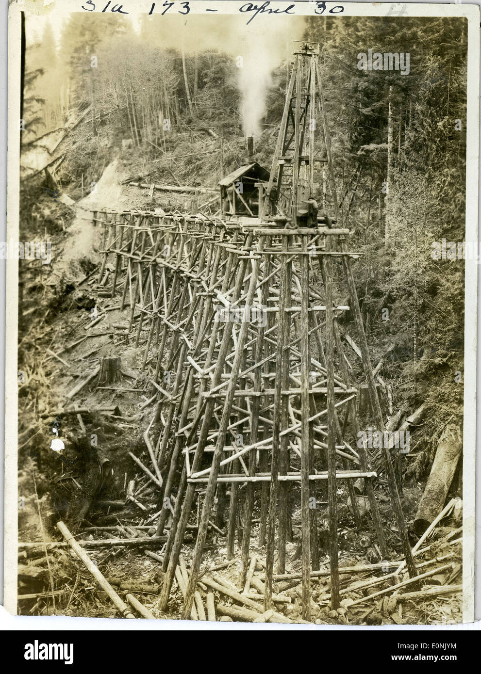 This image captures the ongoing construction of a railroad bridge, an ...