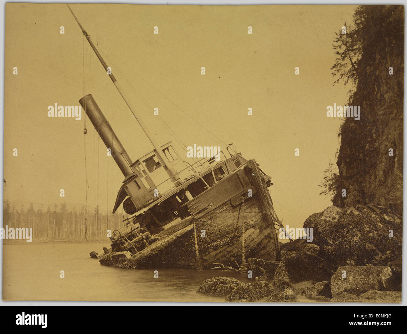 A historical image showing the grounded Beaver ship in Burrard Inlet, B ...