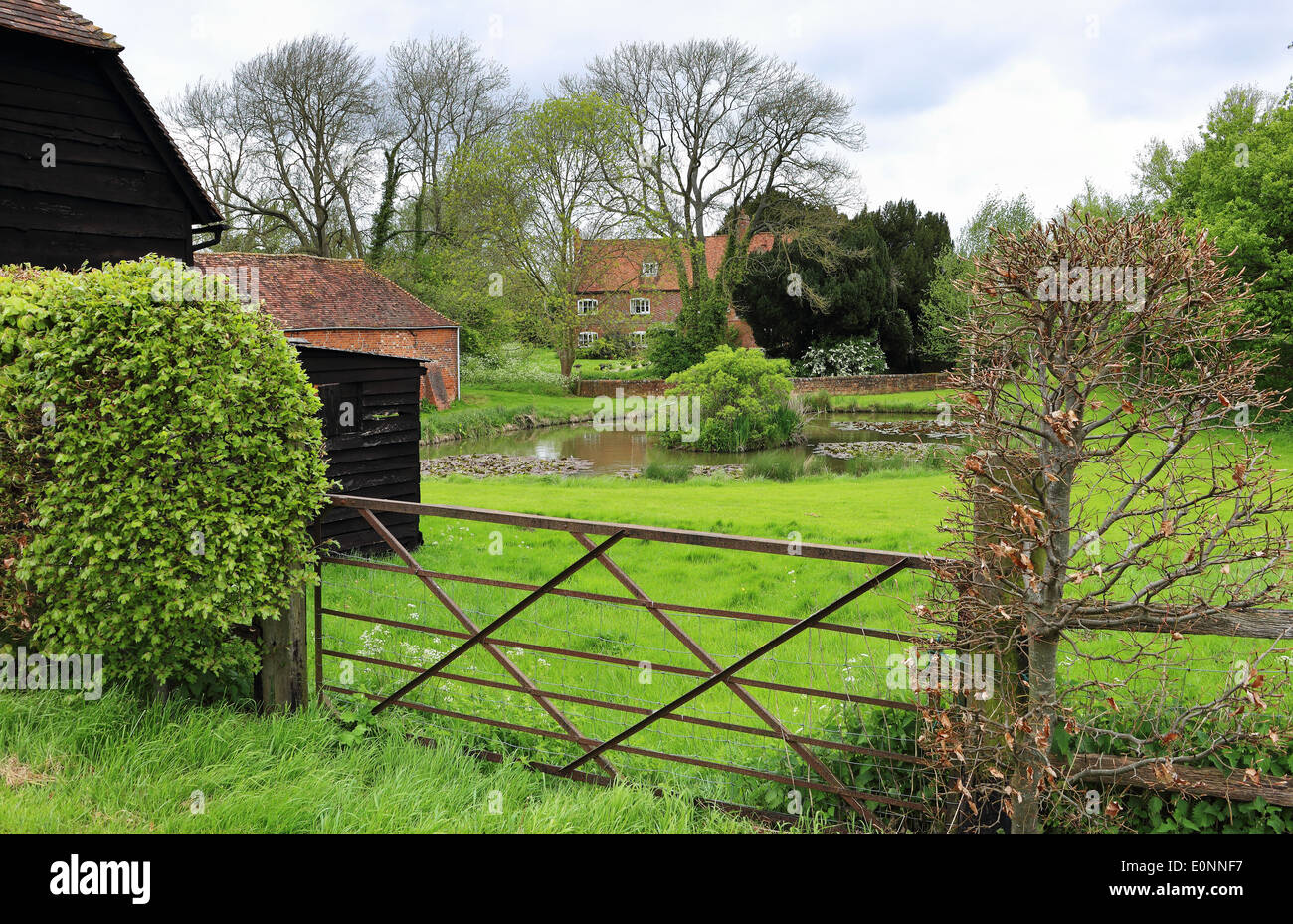 English Rural Manor Farmhouse and garden with duck pond Stock Photo - Alamy