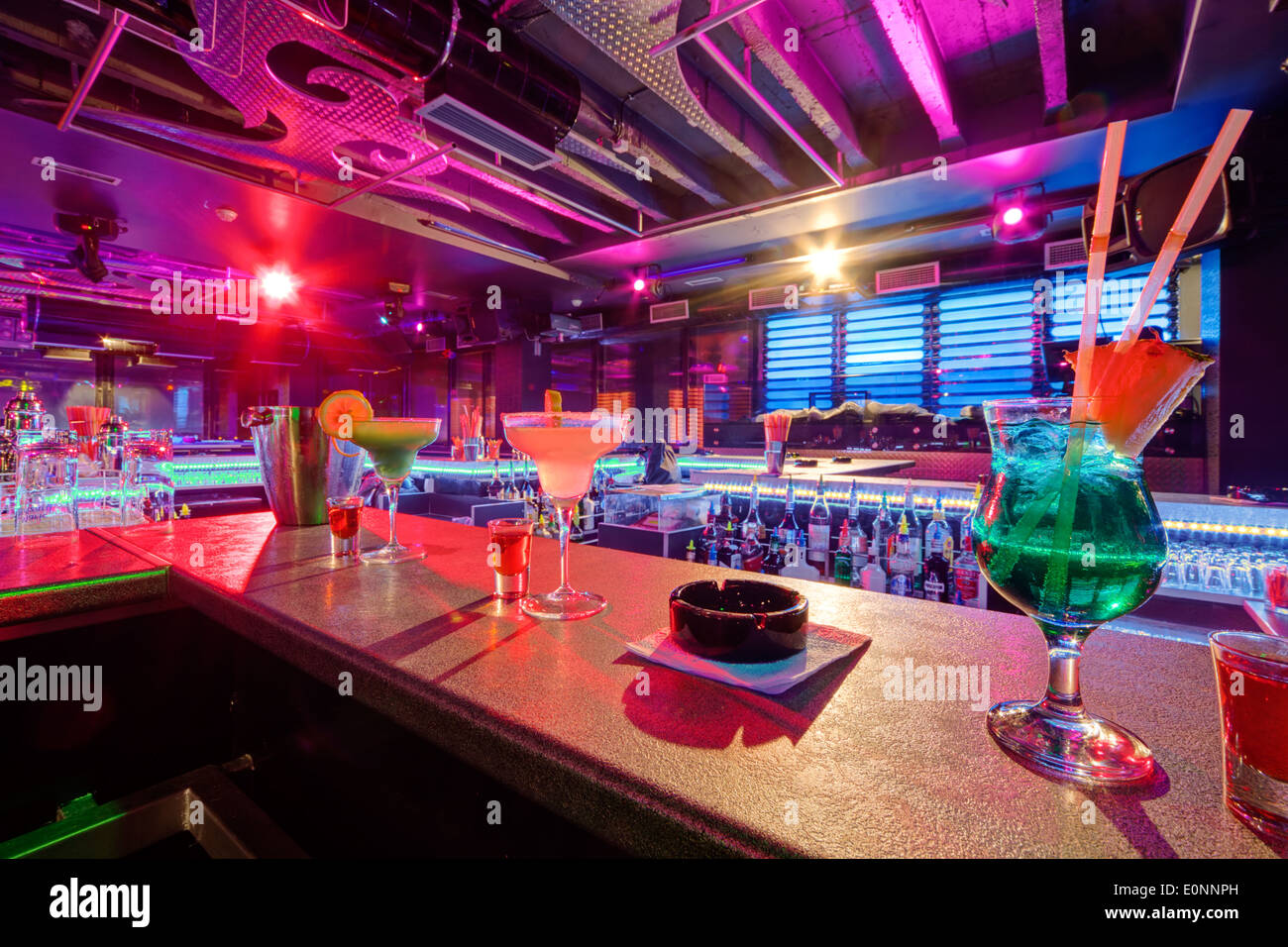 cocktail at bar in a night club with vivid colors Stock Photo - Alamy