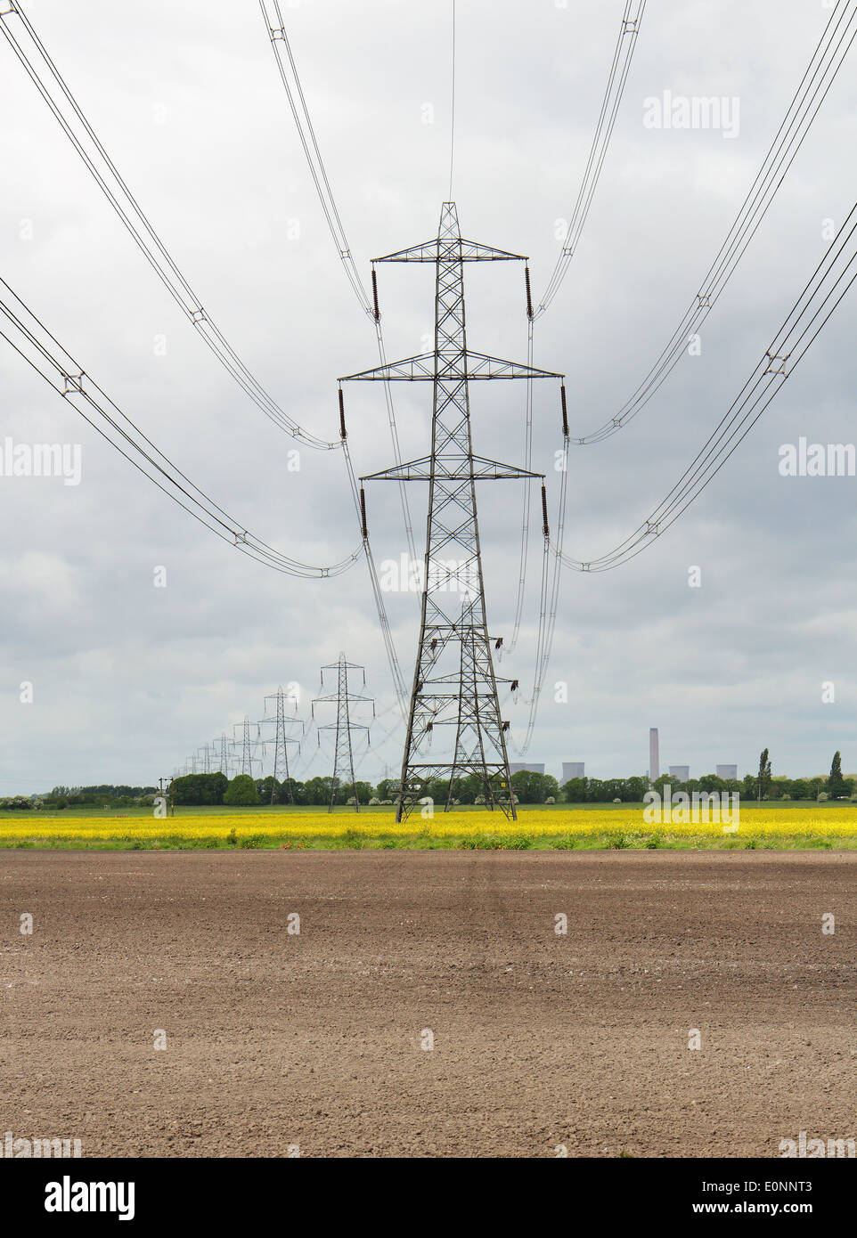 An English Landscape with electricity Pylons with Power Station in the ...