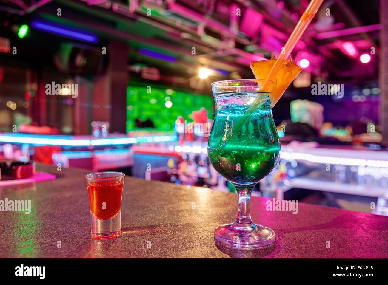 cocktail at bar in a night club with vivid colors Stock Photo - Alamy