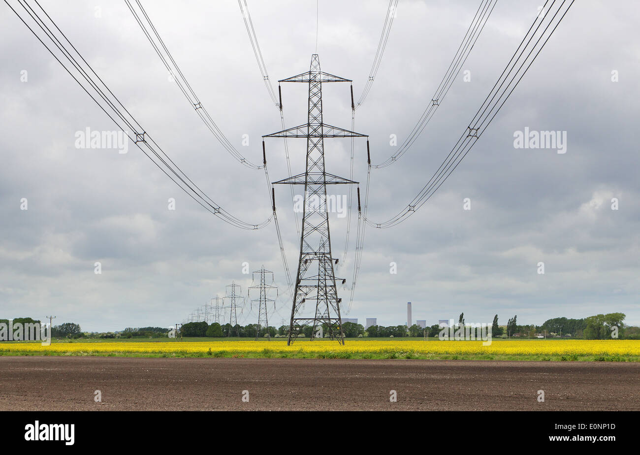 An English Landscape with electricity Pylons and Power Station in the ...