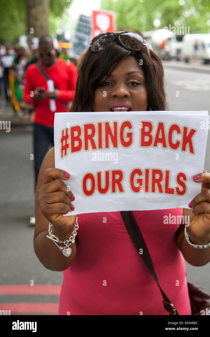 Protester holding board written "#Bring back our girls Stock Photo - Alamy
