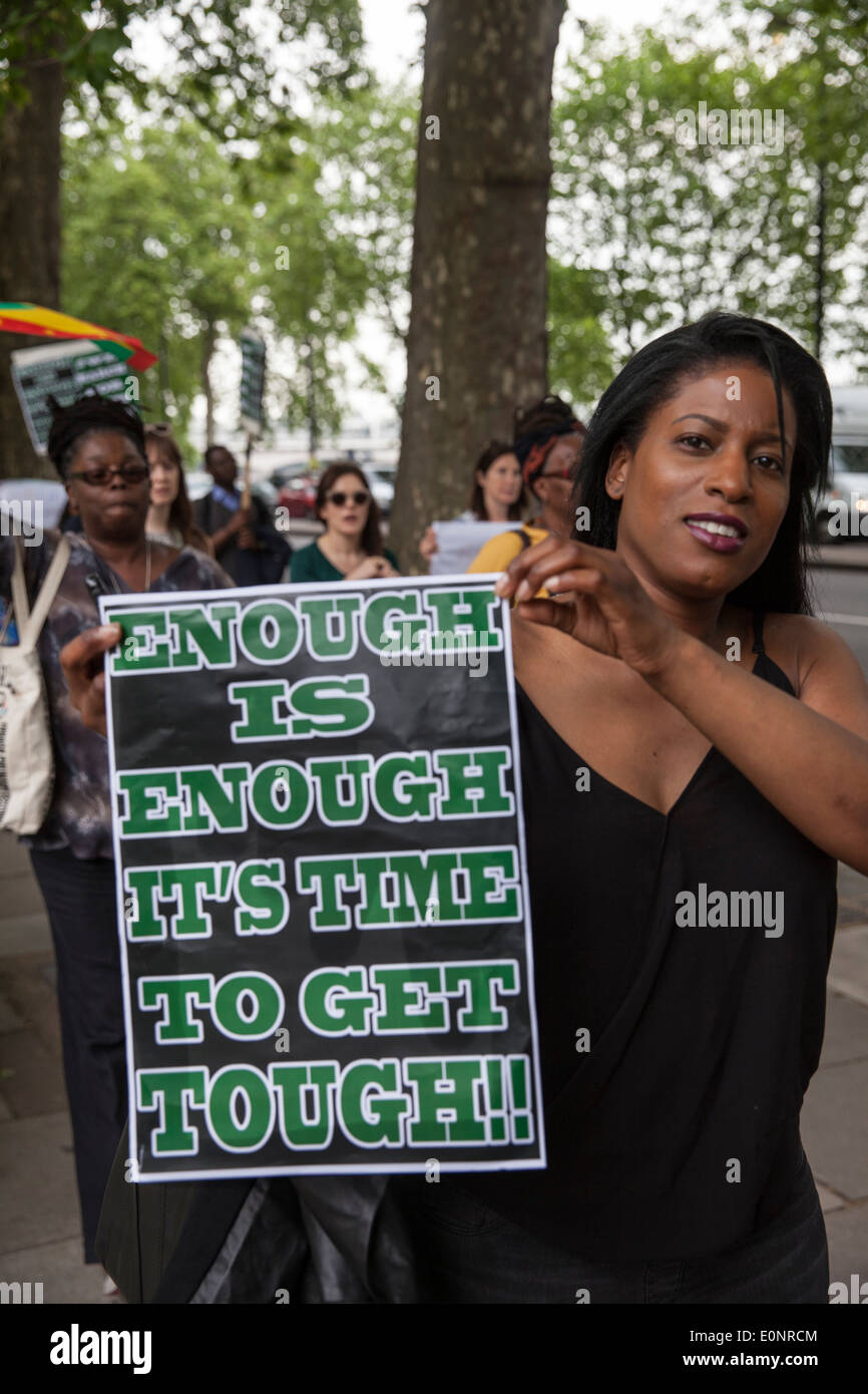 Protester holding board while marching in London for the 234 missed ...