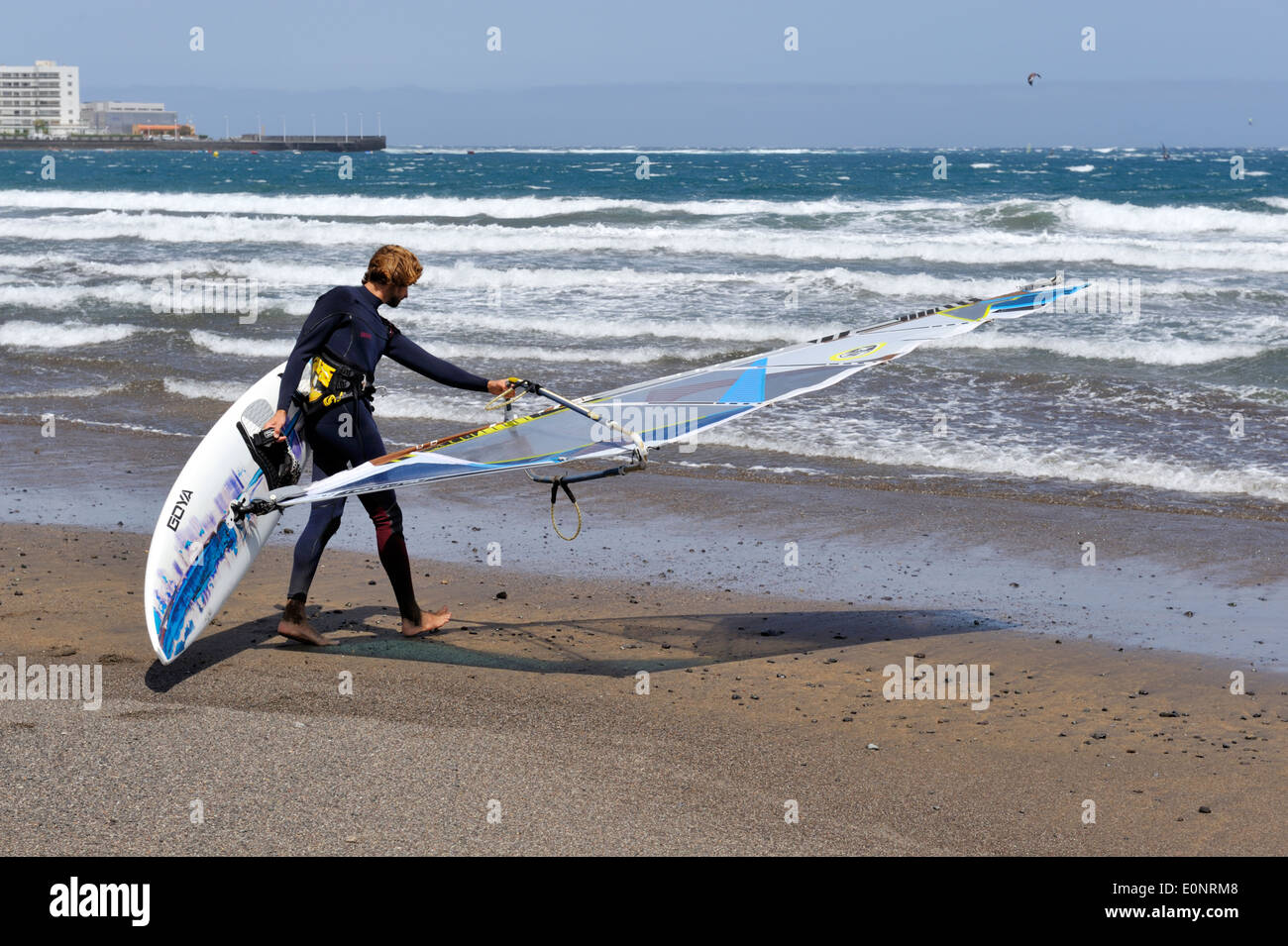 Wind surfer on beach of El Medano, Tenerife with sail and board Stock ...