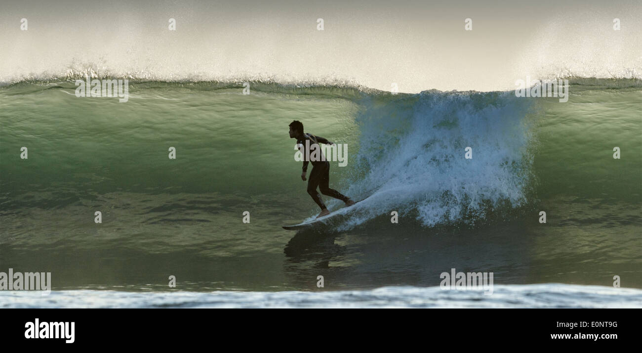 Surfer riding a wave Stock Photo - Alamy