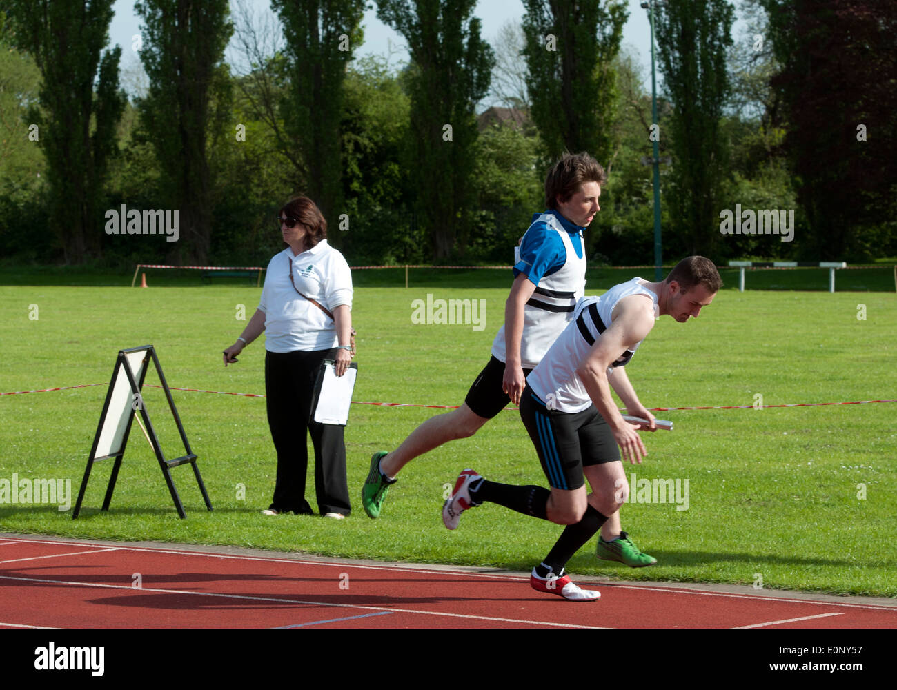 Athletics, runners in men`s 4X400m relay race at club level, UK Stock ...