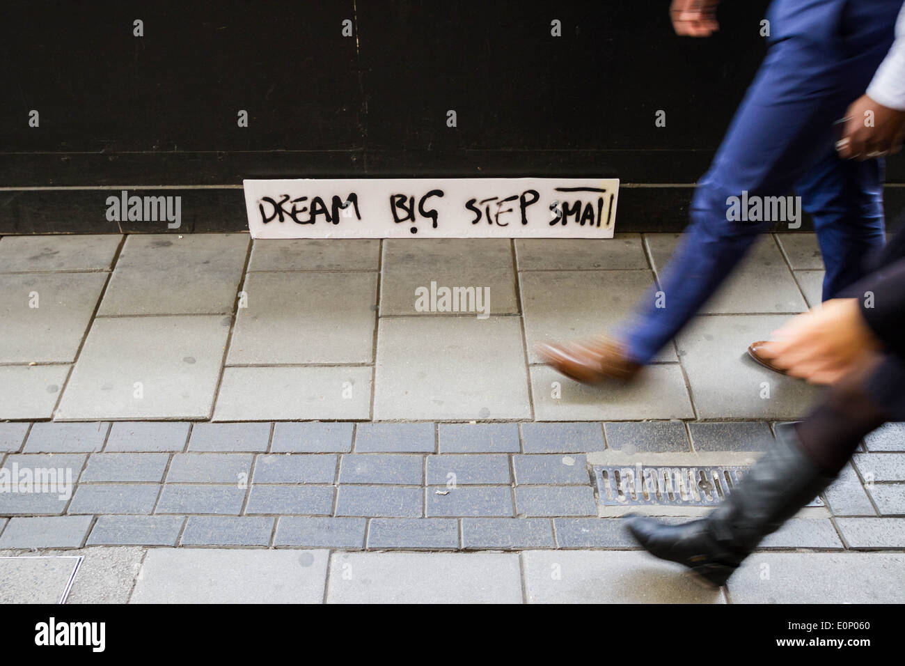 'Dream Big Step Small' street graffiti quote on central London pavement ...