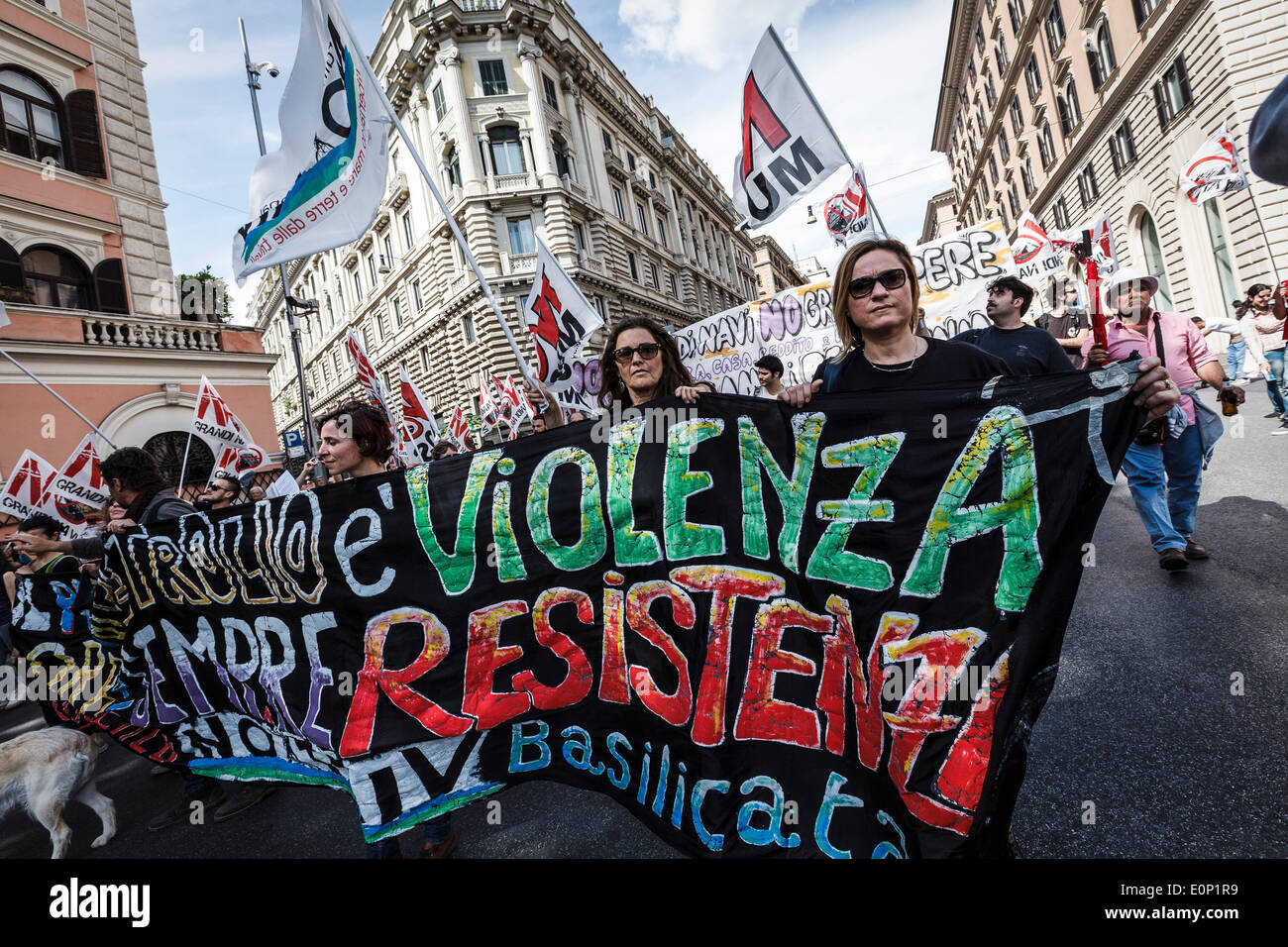 Rome, Italy. 17th May, 2014. Protesters wave flags and hold banners ...