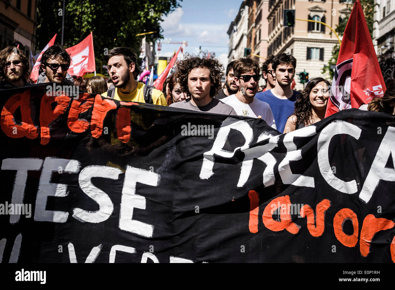 Rome, Italy. 17th May, 2014. Protesters wave flags and hold banners ...