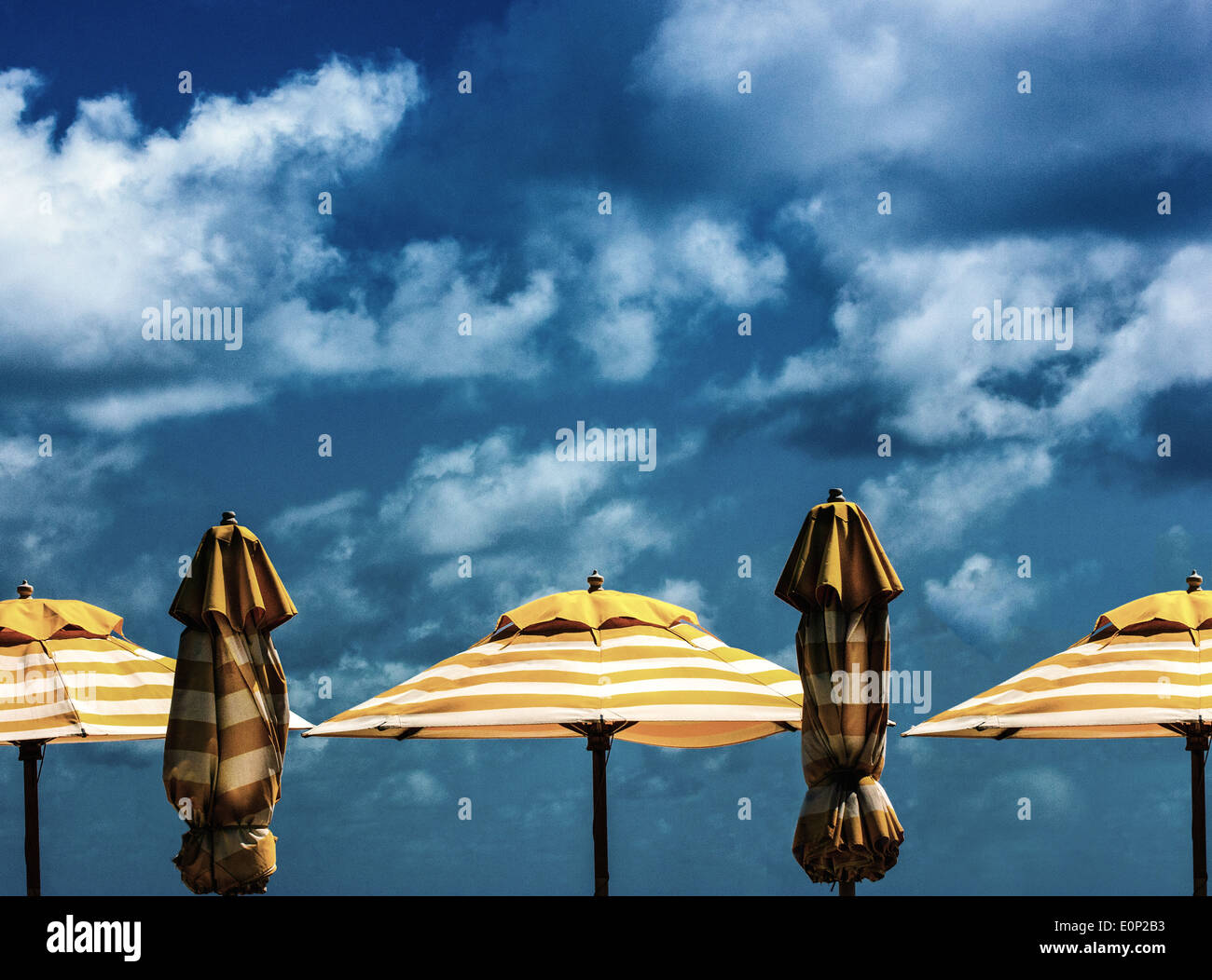 Blue striped beach umbrella hi-res stock photography and images - Alamy
