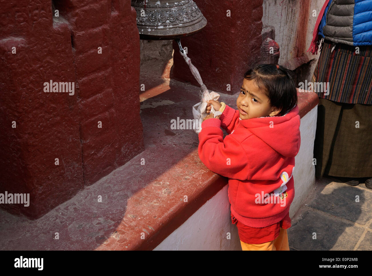 Child ringing big bell Stock Photo - Alamy
