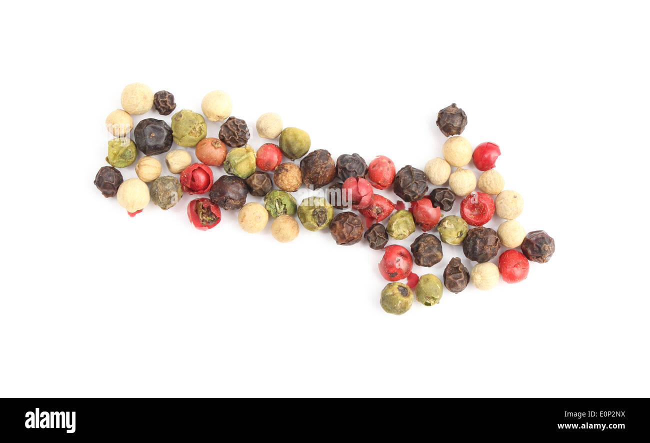 Colored pepper arranged in shape of an arrow. Isolated on white ...