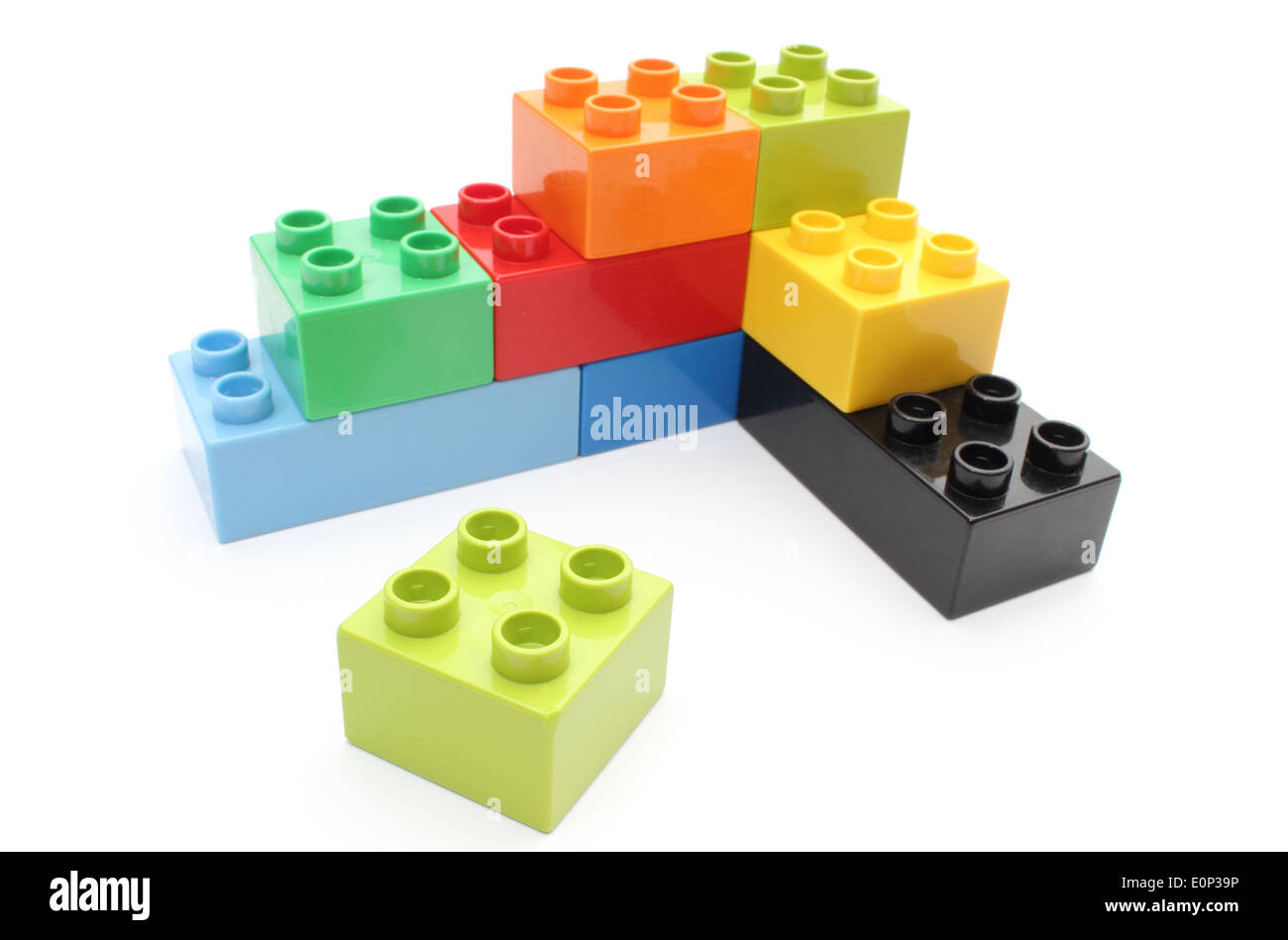 Closeup of building blocks isolated on white background Stock Photo - Alamy