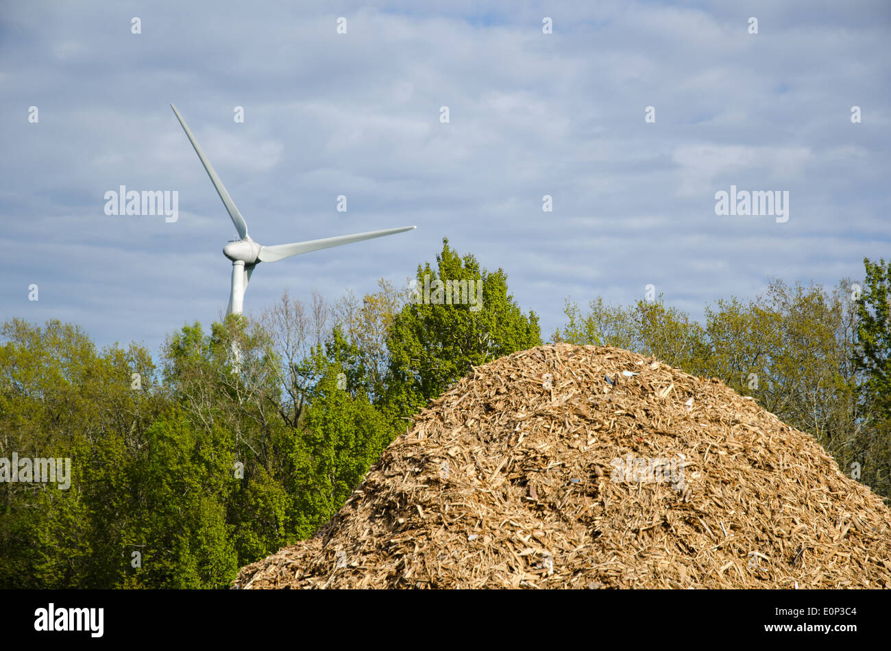Renewable energy from wind turbine and wood chips Stock Photo - Alamy