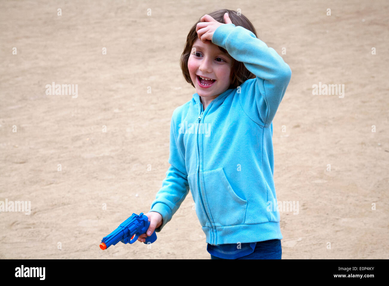 Boy playing with gun hi-res stock photography and images - Alamy