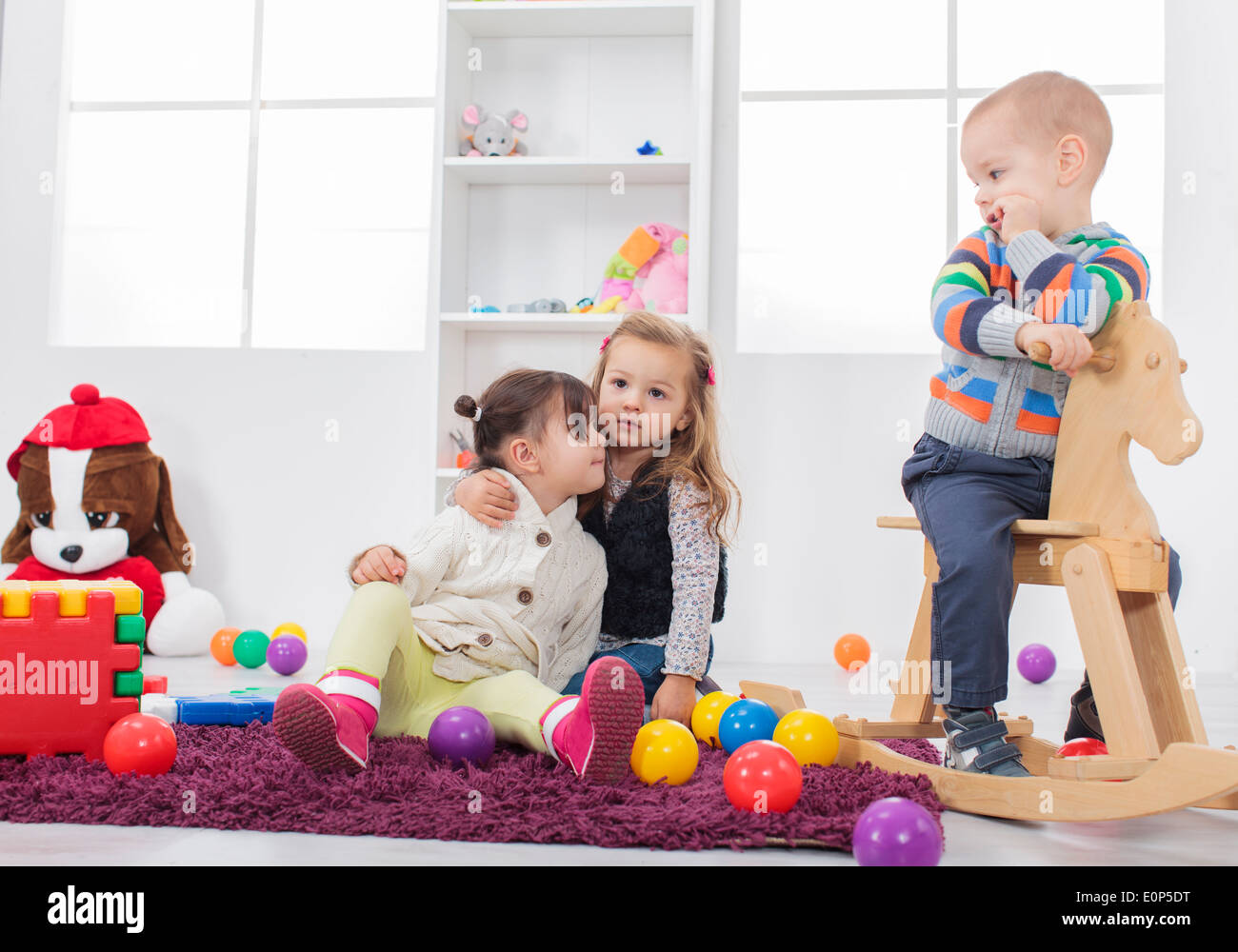 Kids playing in the room Stock Photo - Alamy