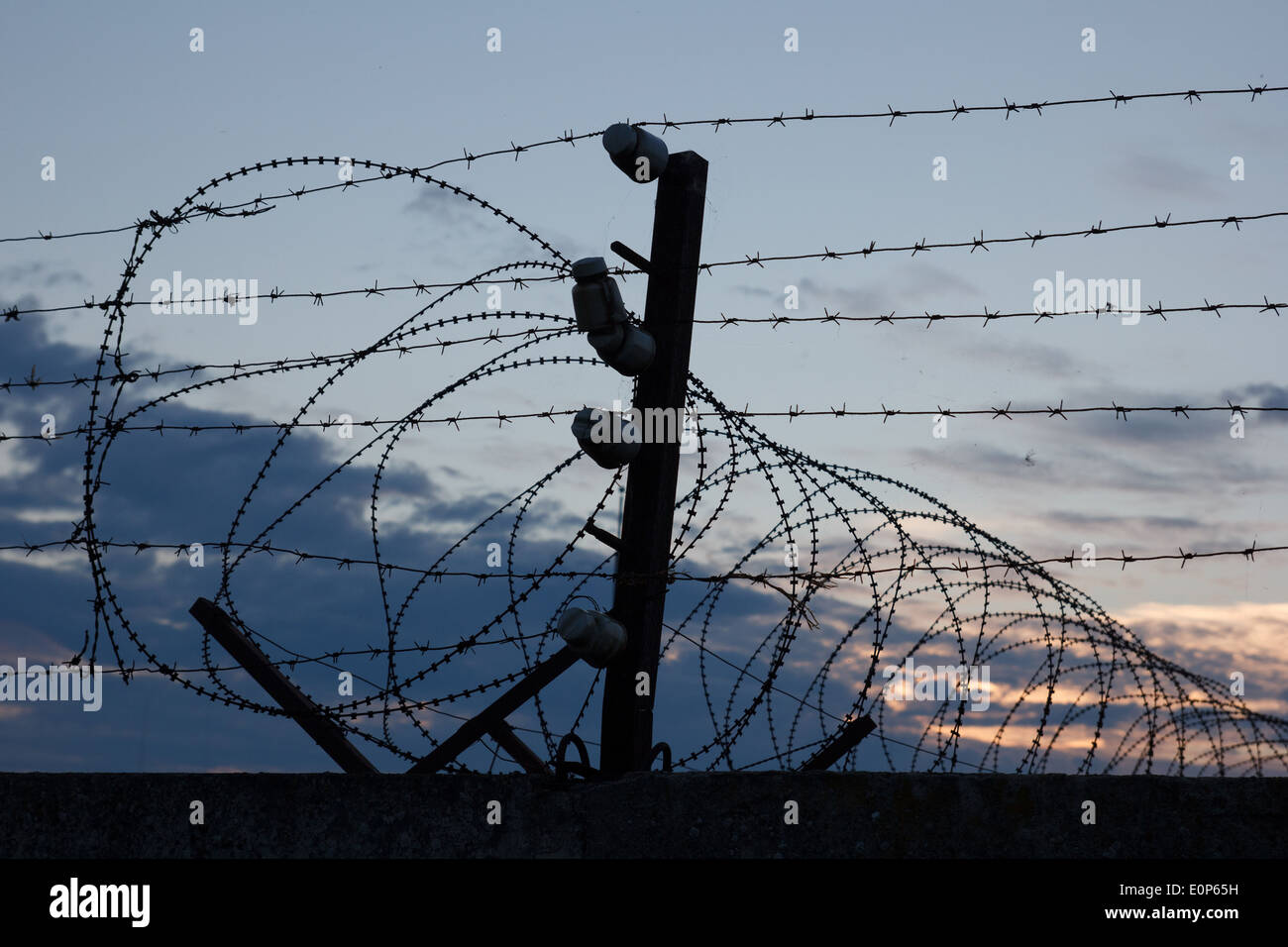 Barbed wire spiral fence hi-res stock photography and images - Alamy
