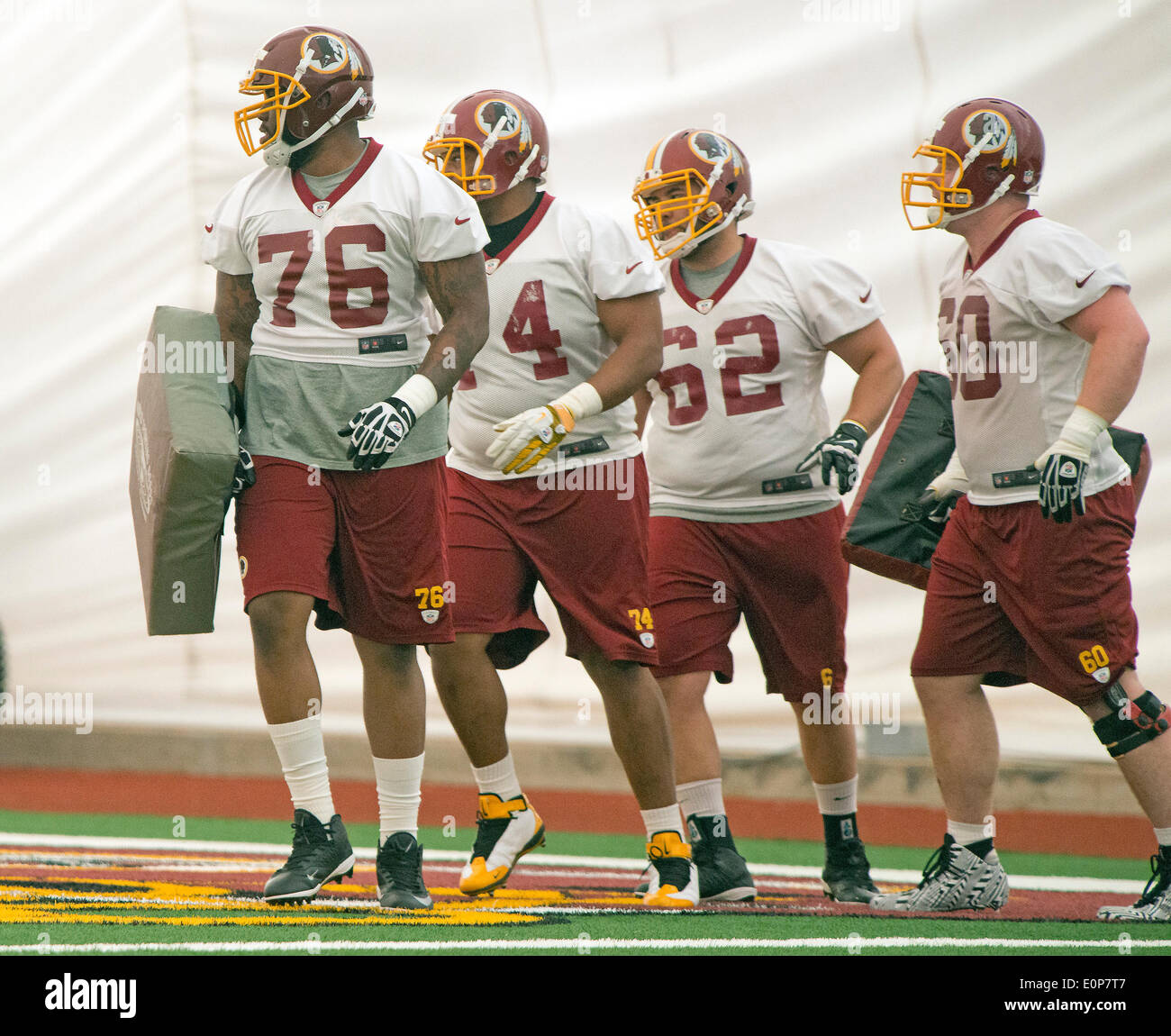 From left to right, offensive linemen Morgan Moses (76) of Virginia ...