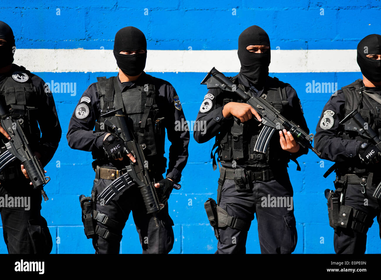 Members of the specialized Police anti-gang unit pose for pictures ...