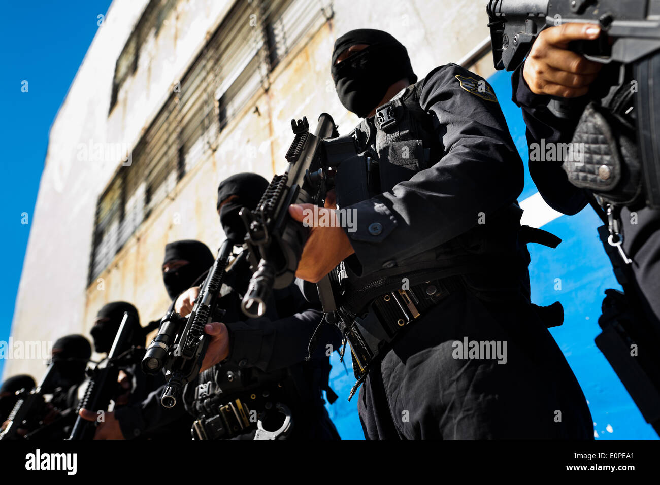 Members of the specialized Police anti-gang unit pose for pictures ...