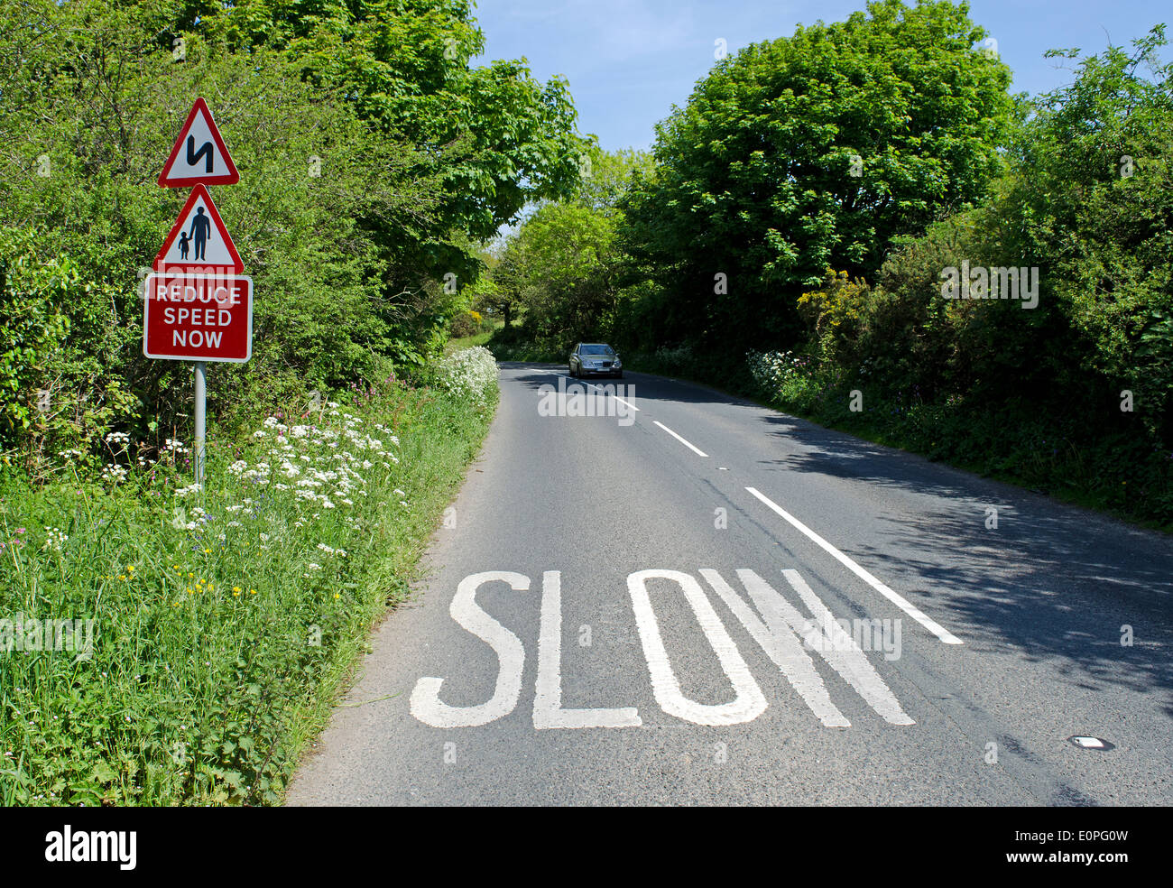 Slow down road sign hi-res stock photography and images - Alamy