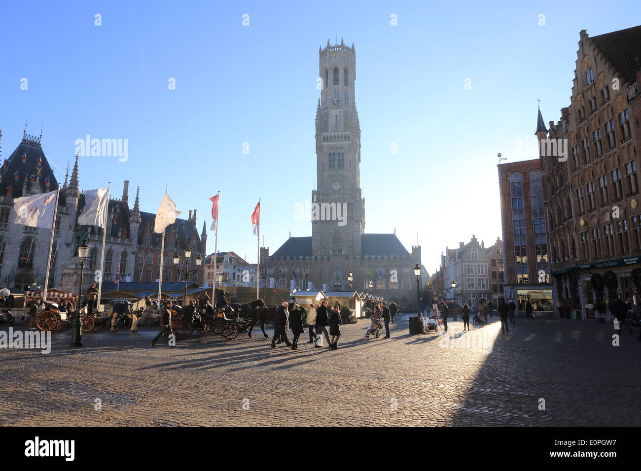 Market Square and the Belfry in Bruges/Brugge, in the early morning ...