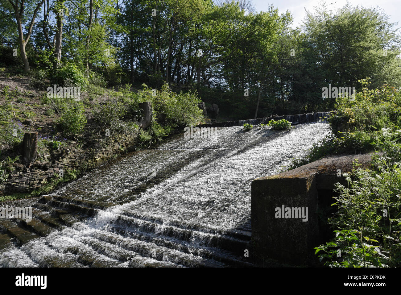 The overflow at Forge dam in Fulwood Sheffield England. Flowing water ...