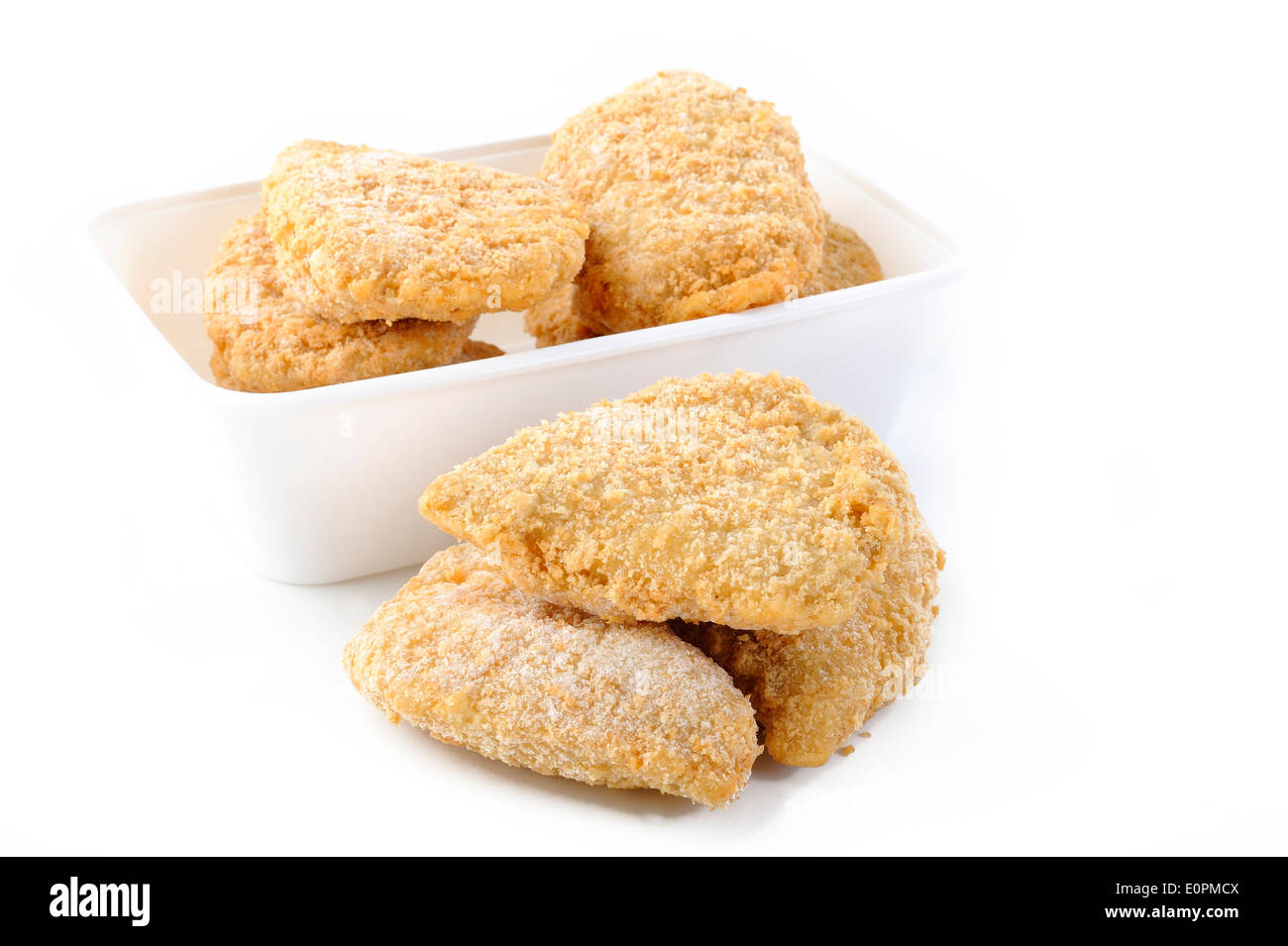 frozen chicken nuggets on white background Stock Photo - Alamy