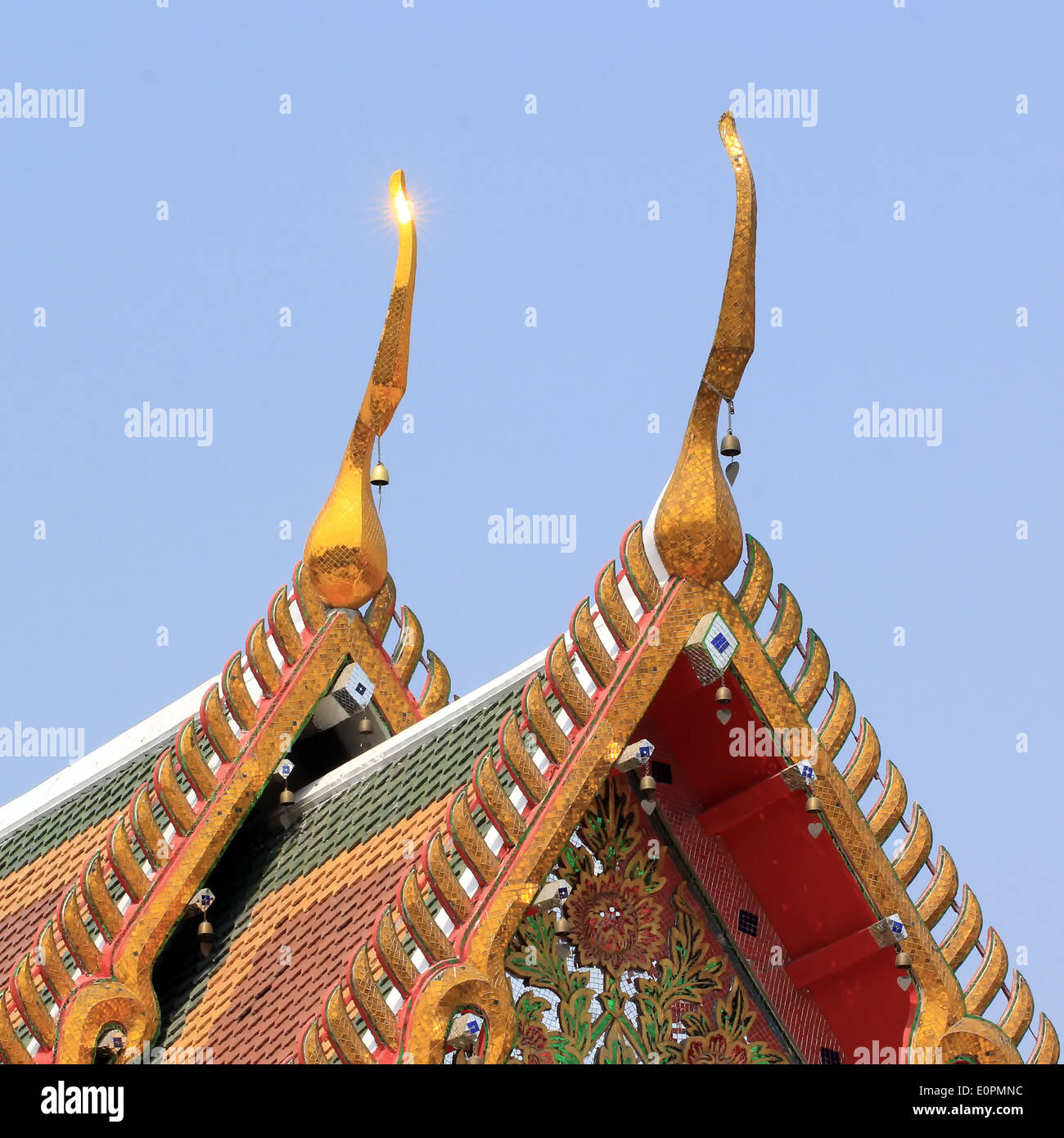 gable apex on temple roof with blue sky background Stock Photo - Alamy