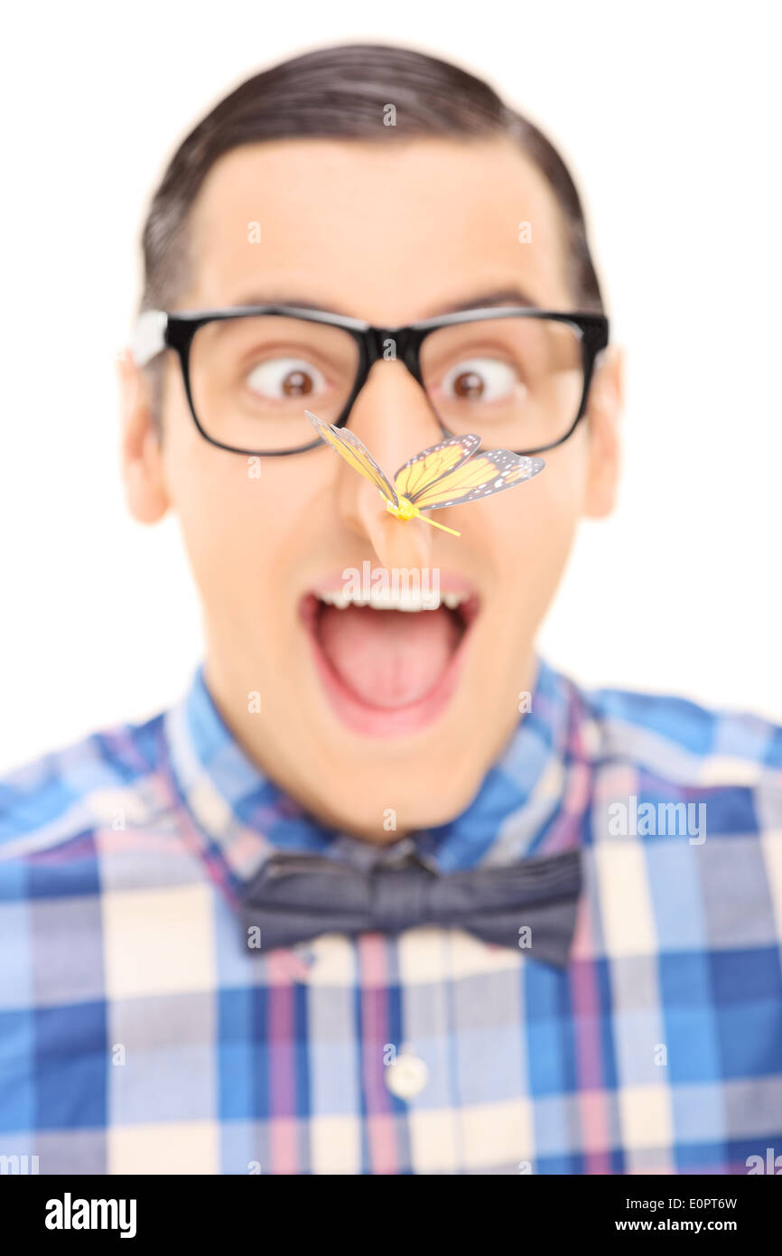 Butterfly standing on the nose of a young man Stock Photo - Alamy
