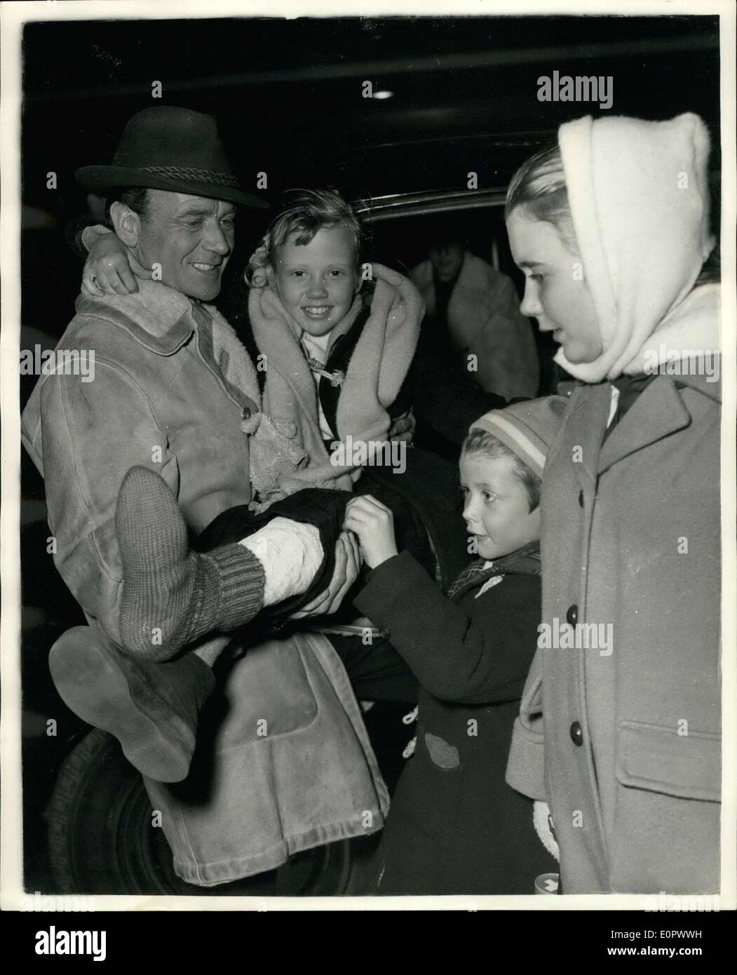 Jan. 19, 1957 - John Mills Carries Daughter From Plane. Film star John ...