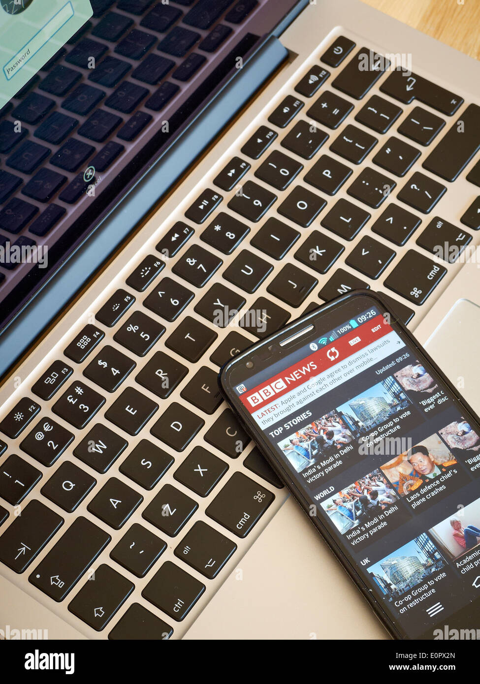 Smart phone on laptop keyboard Stock Photo - Alamy